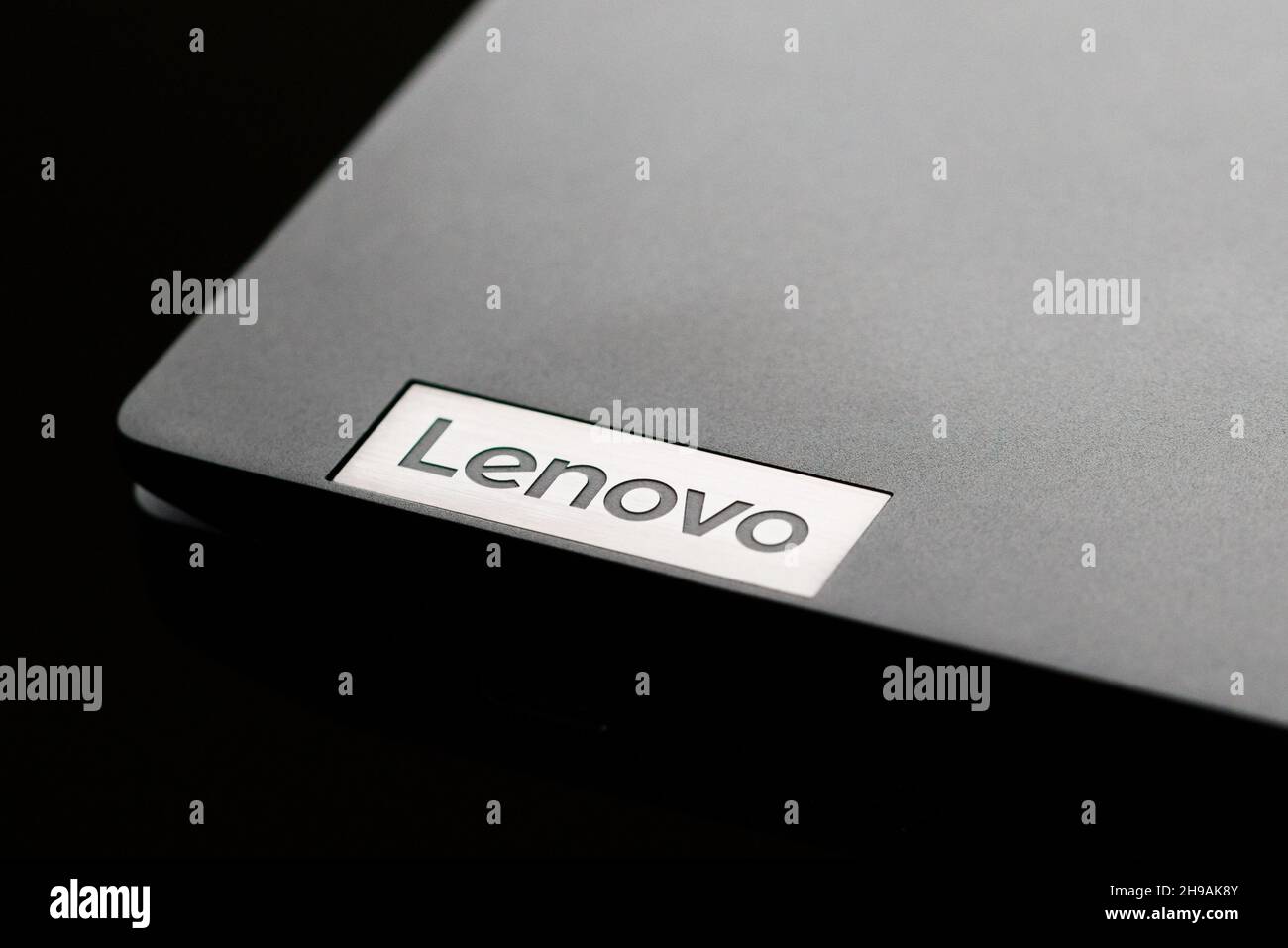 Lenovo commercial logo in the edge of a Thinkpad laptop computer. Close ...