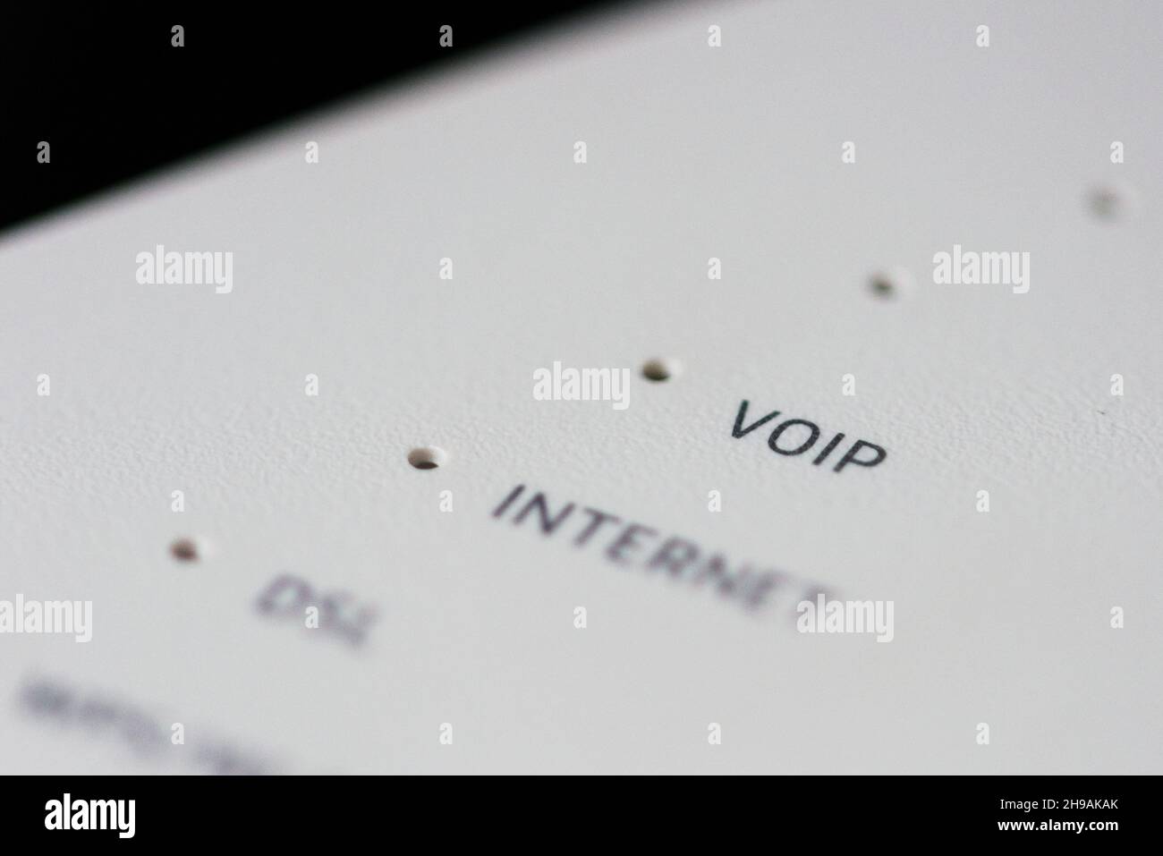 Extreme macro close up of a modem router, focusing on the word "VOIP ...