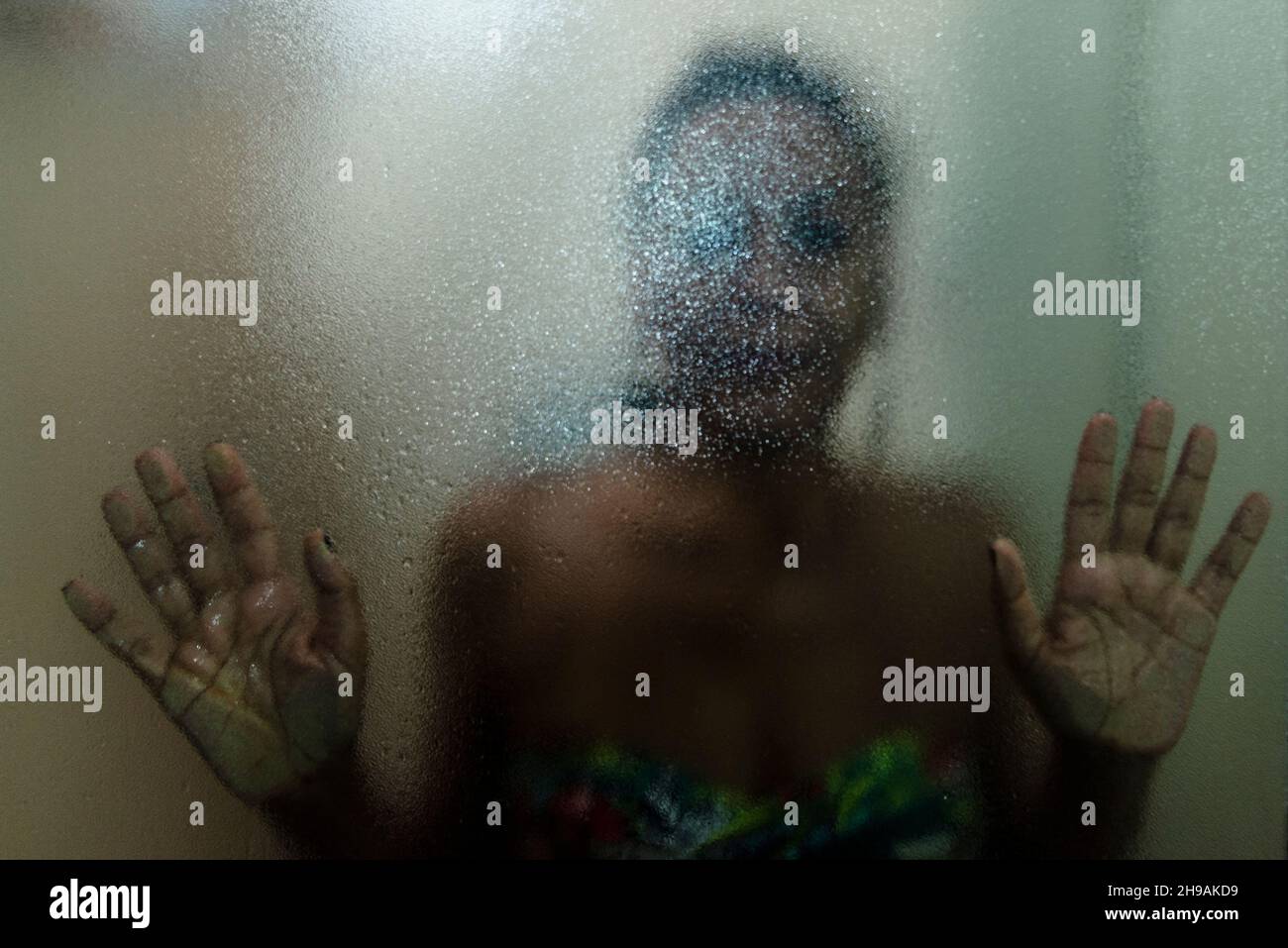 Portrait of a woman in the bathroom washing herself. Salvador, Bahia ...