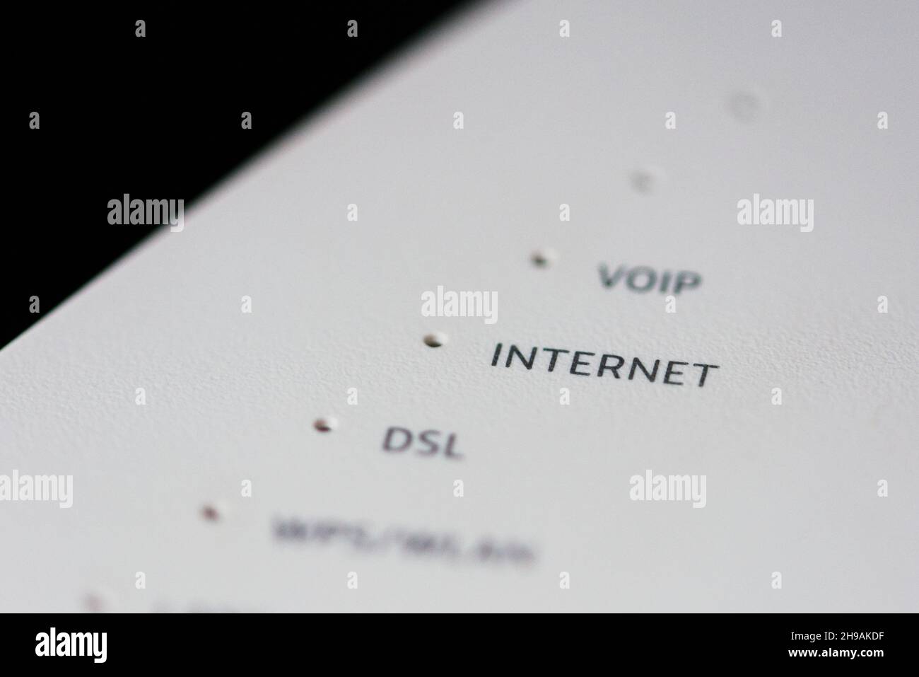 Extreme macro close up of a modem router, focusing on the word ...