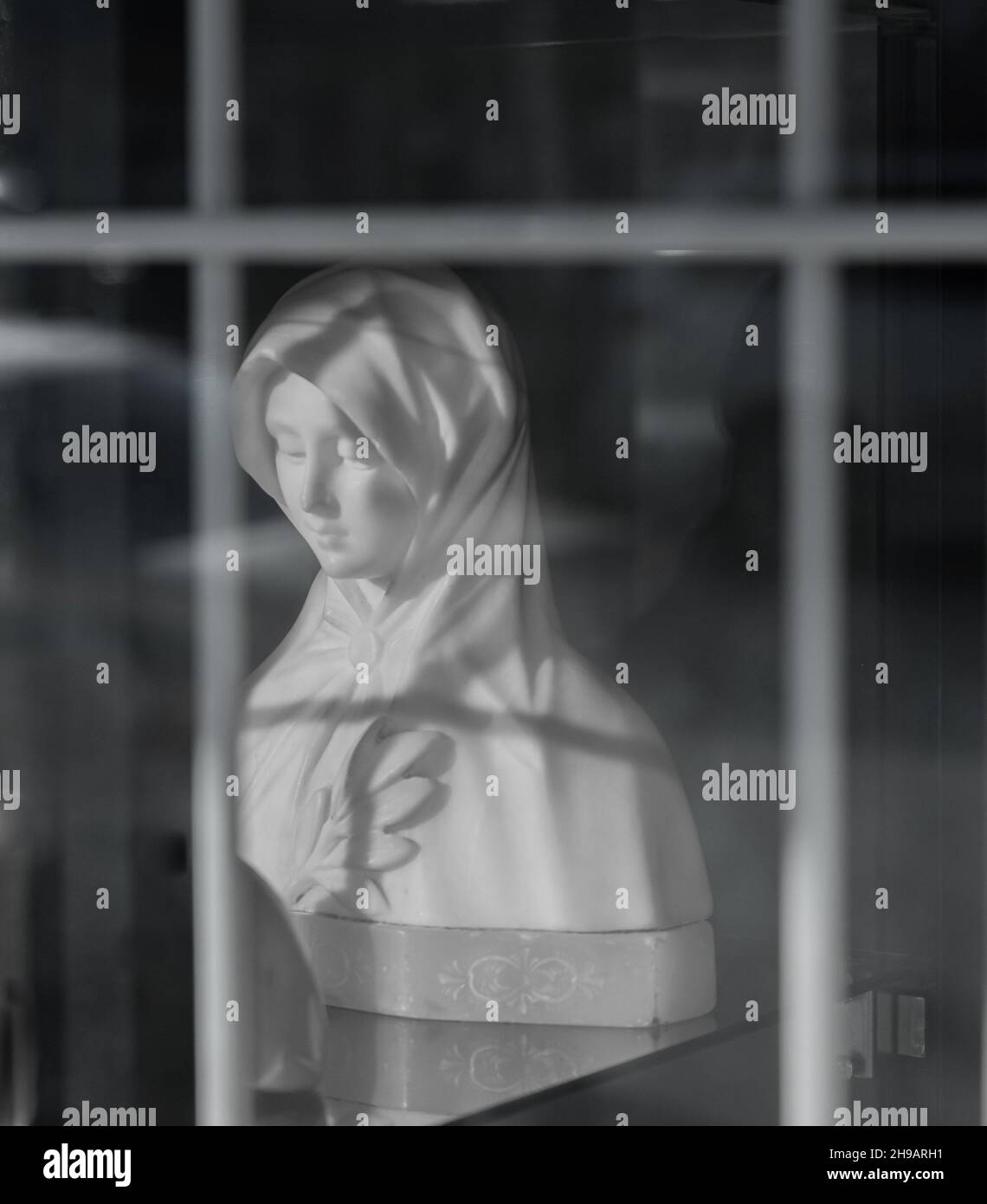 Small marble bust of a Virgin Mary in antigue store. Blessed Mother a ...