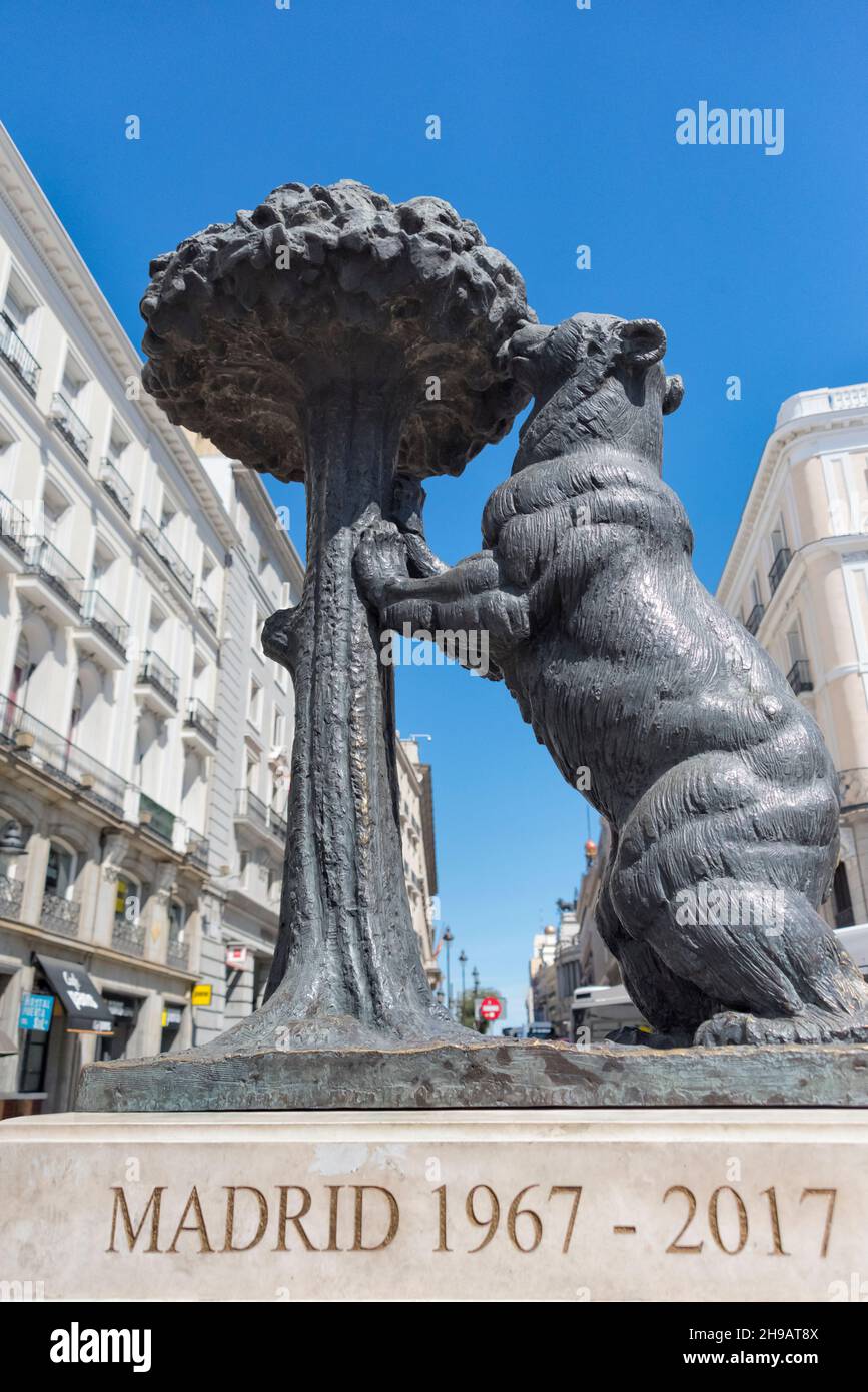 The statue of the bear and the strawberry tree hi-res stock photography ...