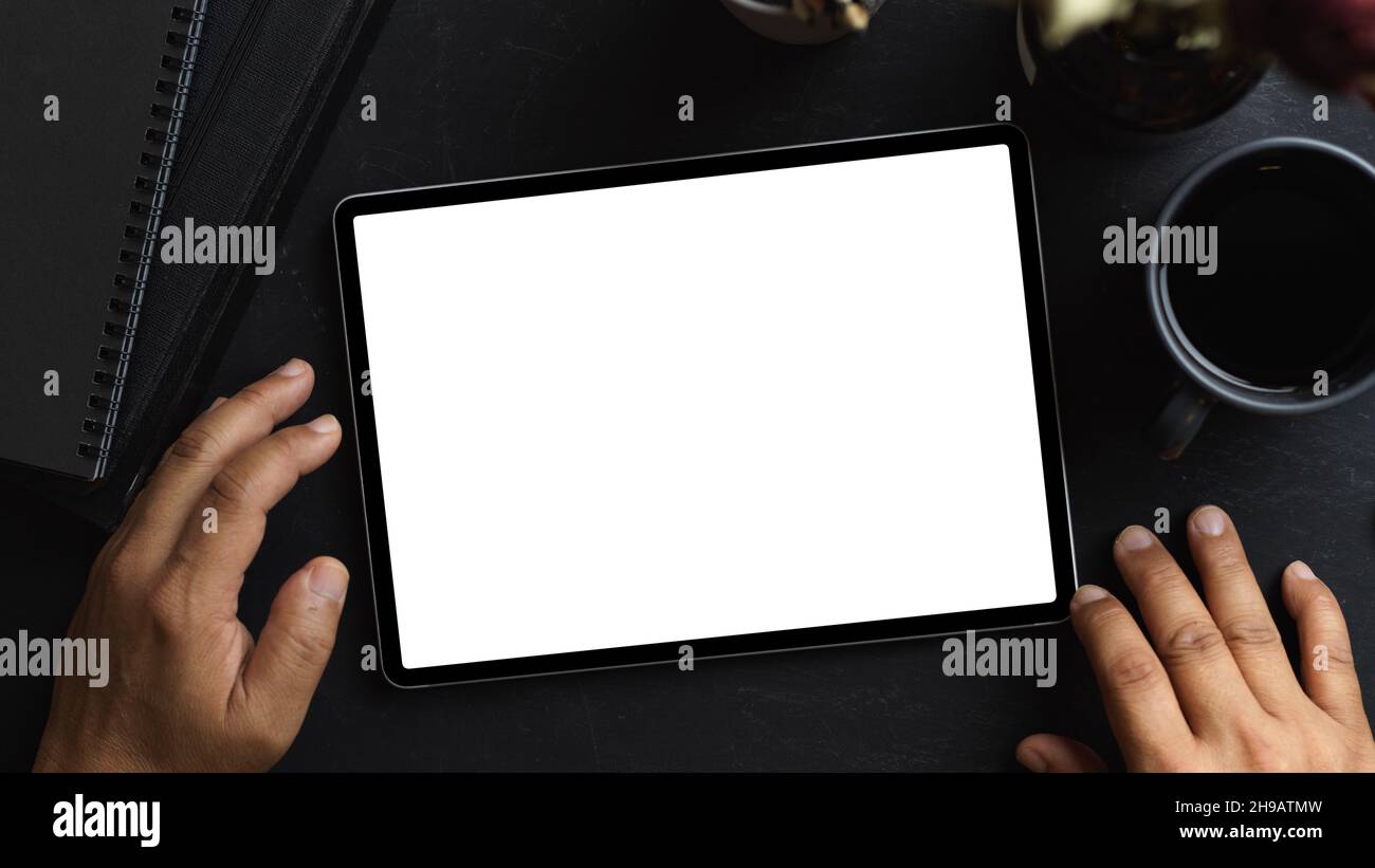 Top view, a digital portable tablet computer white screen mockup on ...