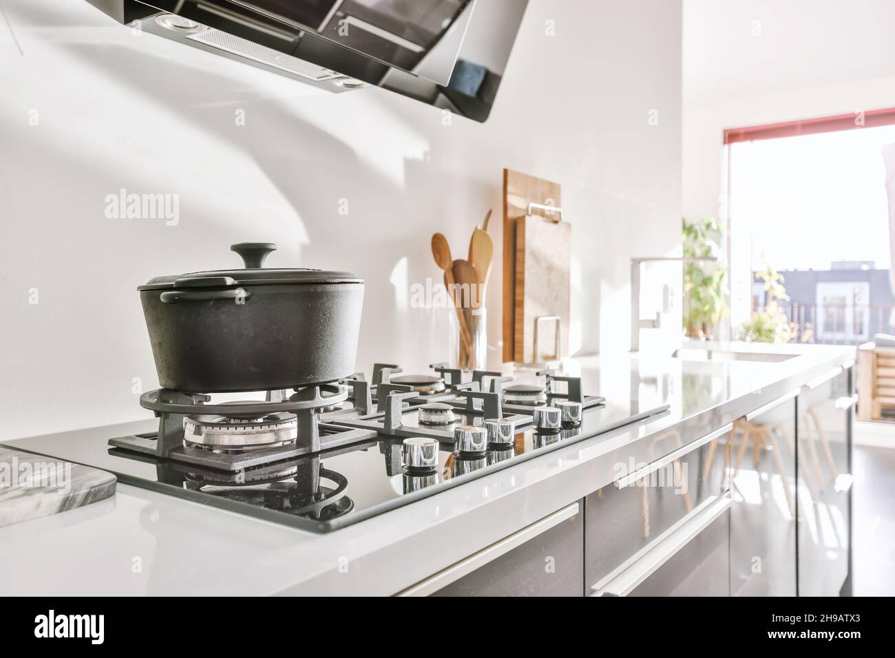 Attractive kitchen with stylish and modern gas hob and ceramic pot ...