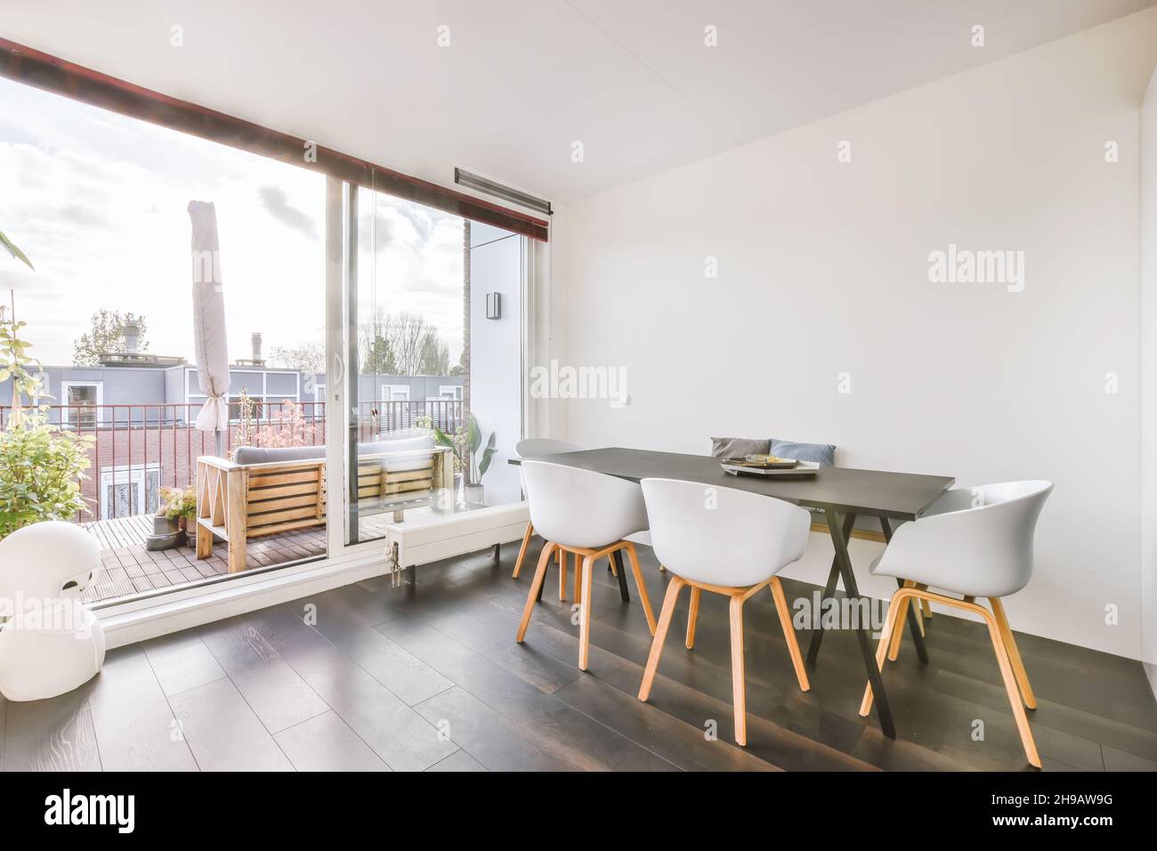 Attractive dining room with large wall-to-ceiling window Stock Photo ...