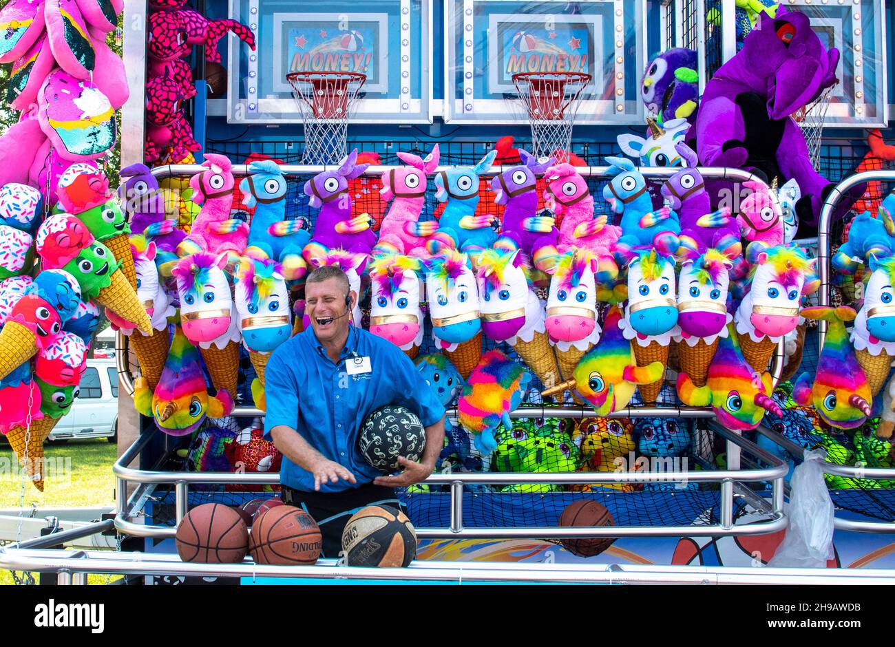 south bend Indiana USA July 4 2021; laughing carnival worker enjoys his ...