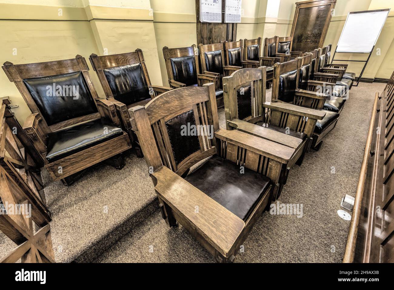 Classic leather and oak jury chairs in jury box of a courtroom of the ...