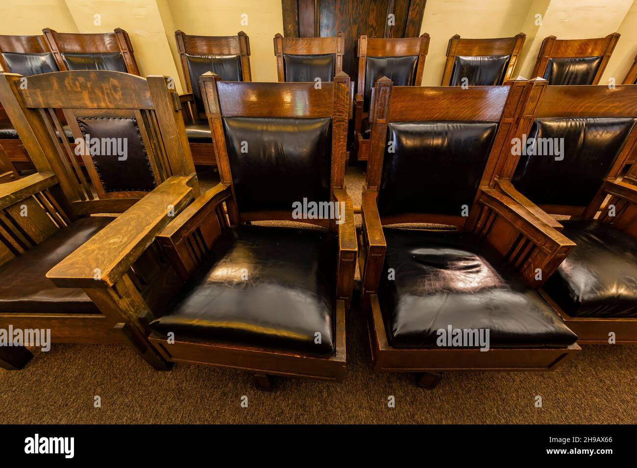 Classic leather and oak jury chairs in jury box of a courtroom of the ...