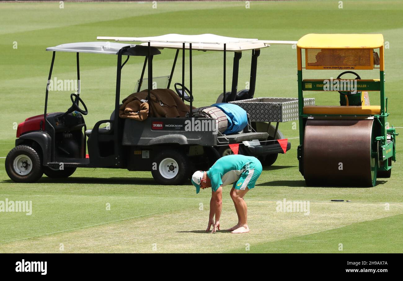 Australia's David Warner inspects the wicket during a nets session at ...