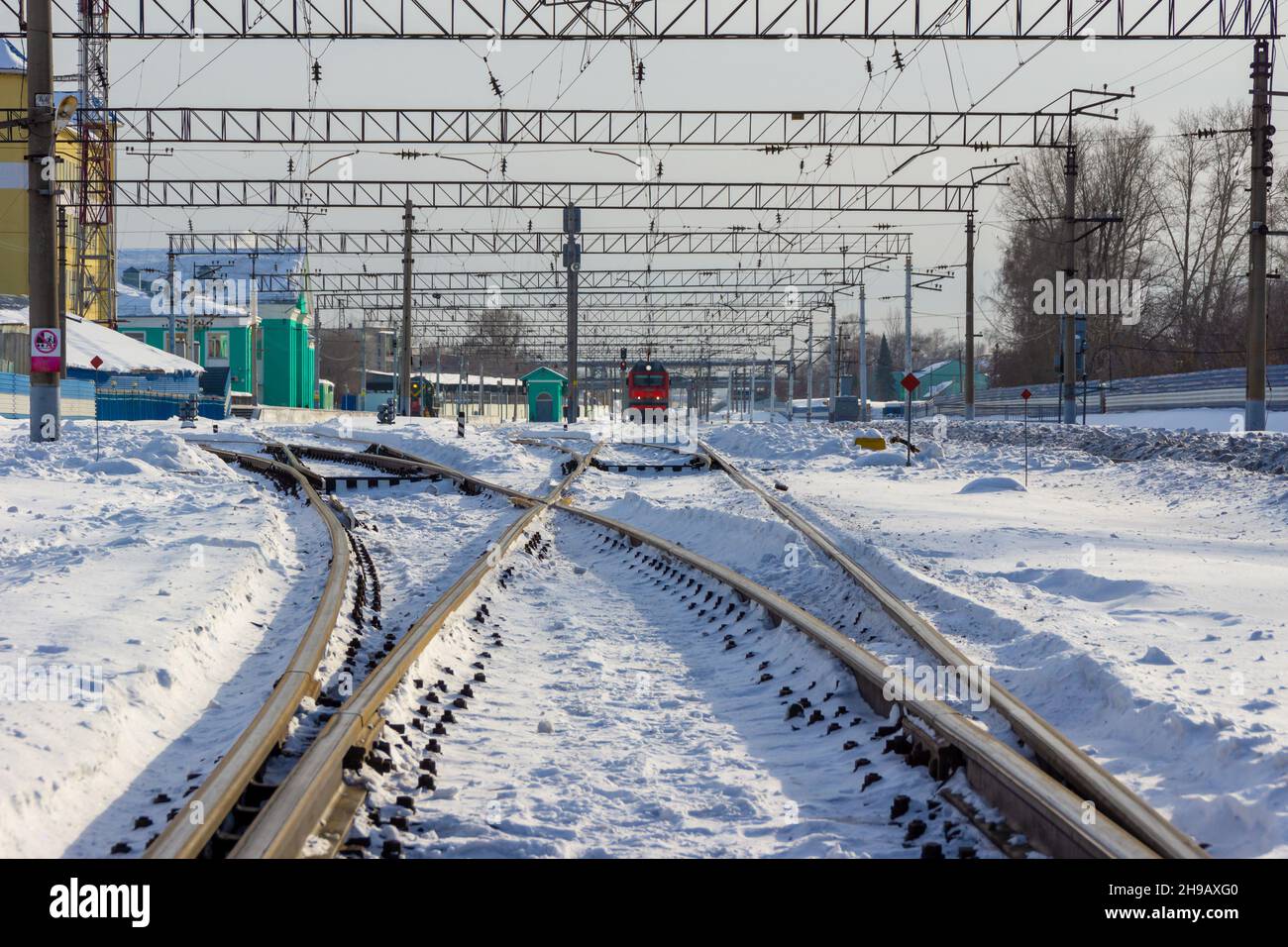 the train approaches the junction of the railroad tracks in the form of ...