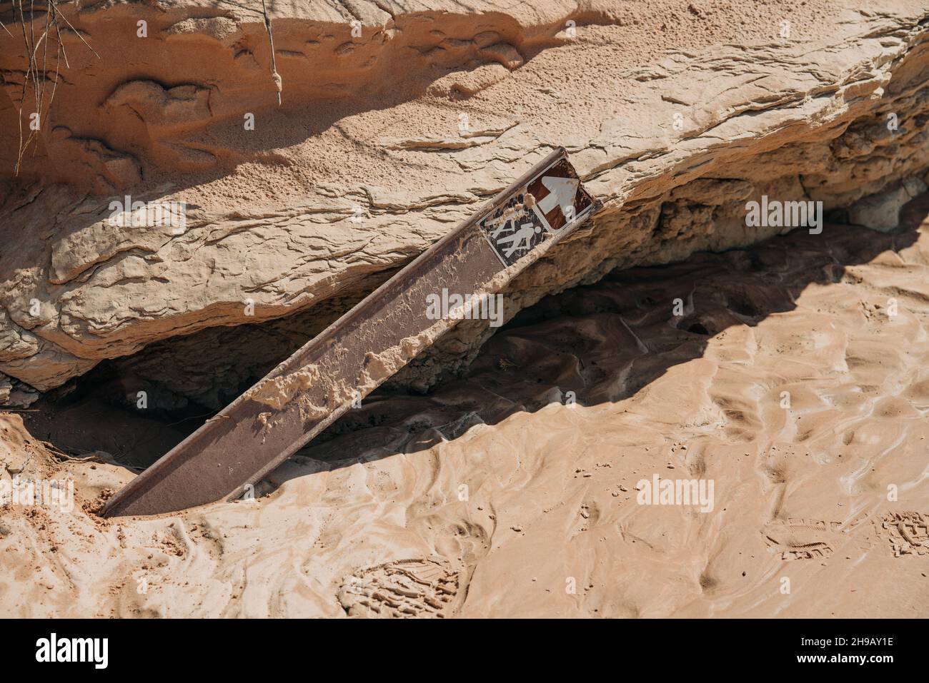 Hiking Trail sign in desert fell down in mud after big rain season ...
