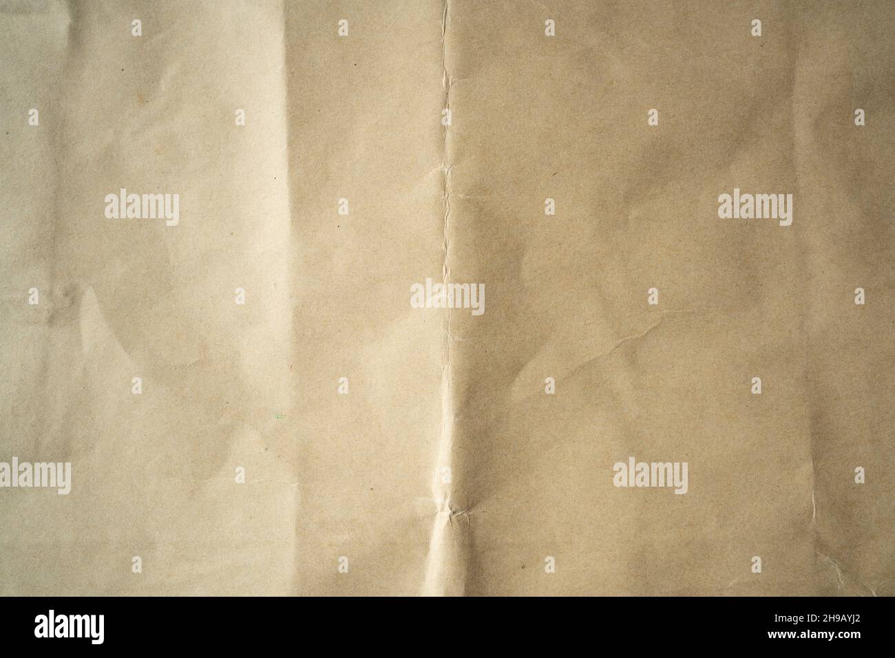 Crumpled Kraft paper with crease in the middle Stock Photo - Alamy