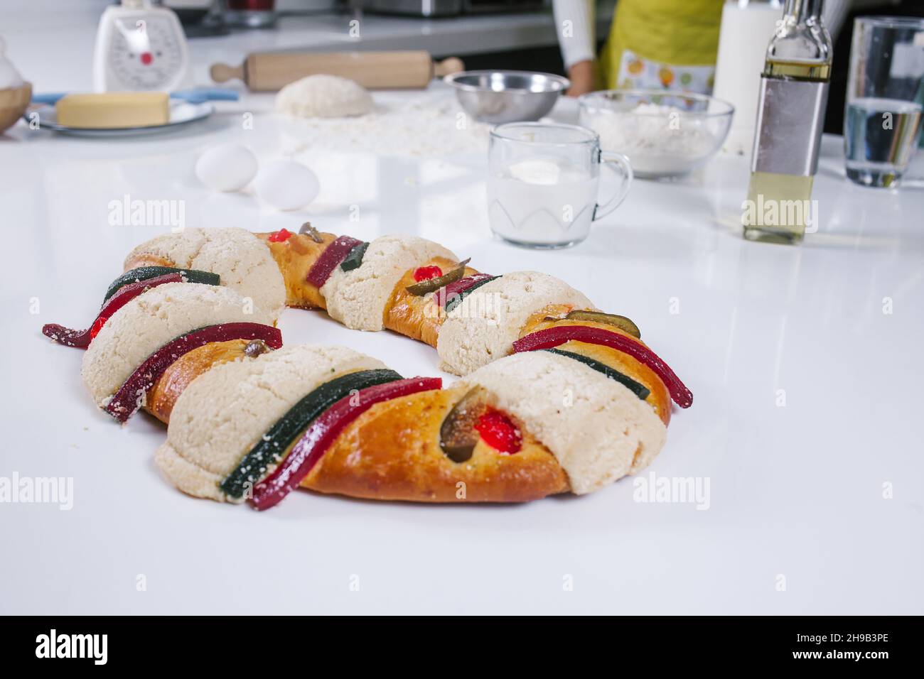 mexican woman baking a traditional rosca de reyes or epiphany cake on ...