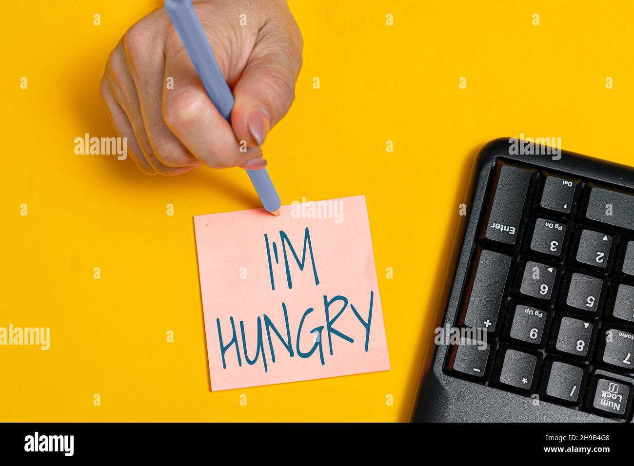 Hungry kid hands on stomach hi-res stock photography and images - Alamy