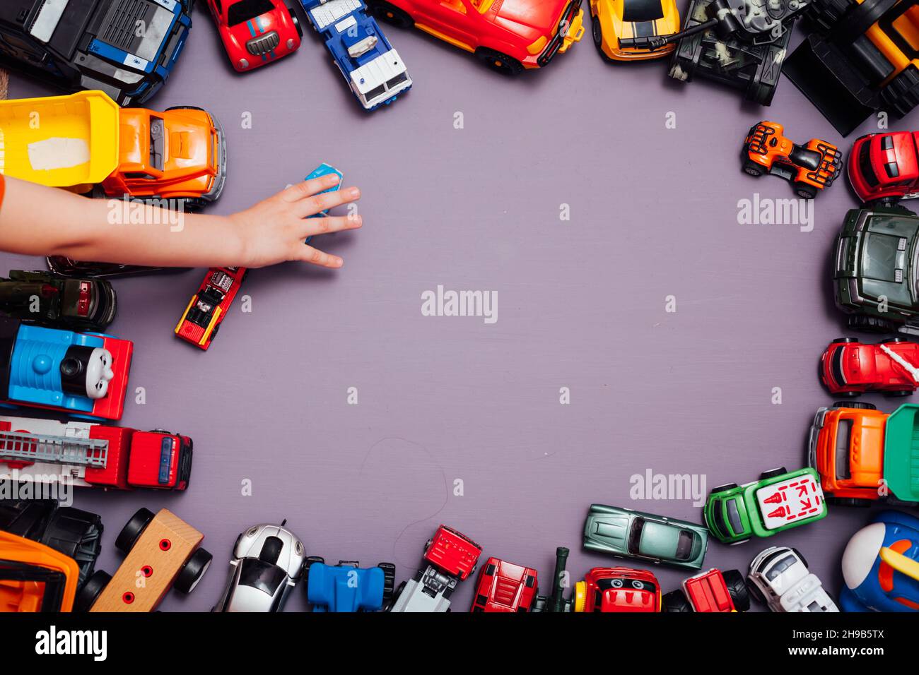 lots of children's toy machines on the background Stock Photo - Alamy
