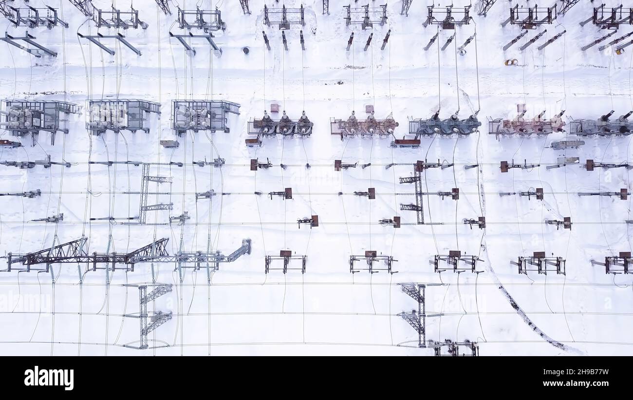 Rows of electric poles. Action. Top view of electrical substation with ...