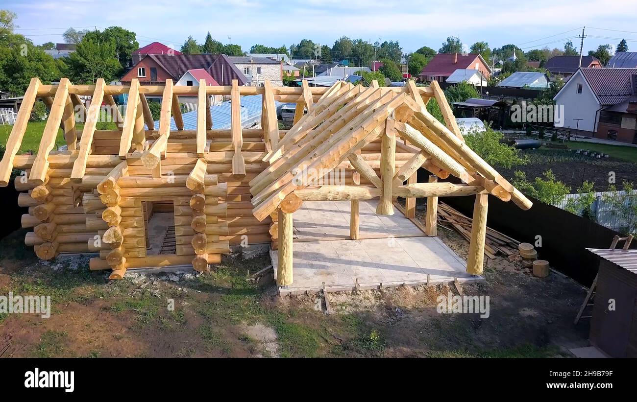 Frame wooden house under construction. Clip. Top view of country wooden ...
