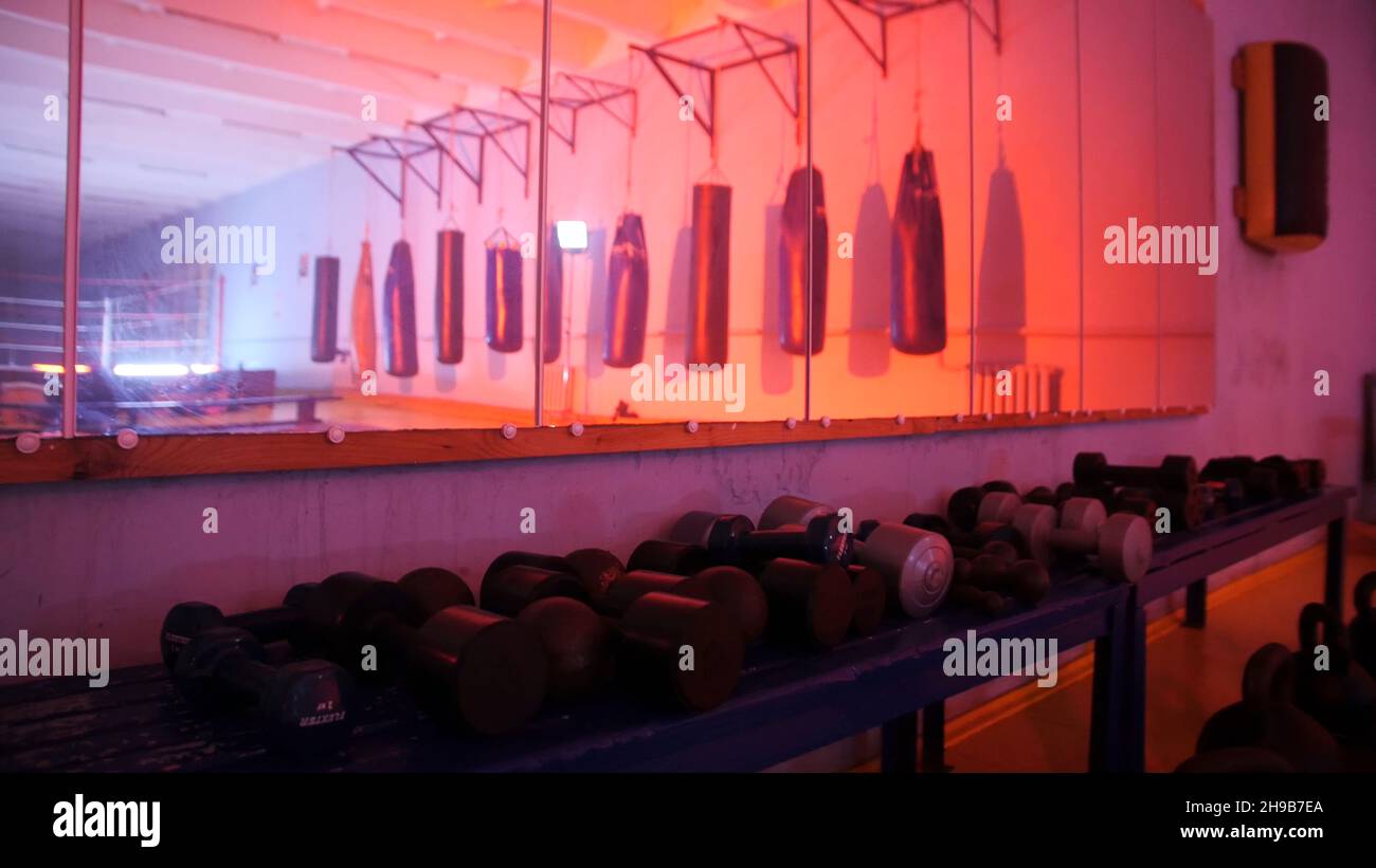 Interior of a boxing hall. Empty modern fight club with punching bags ...