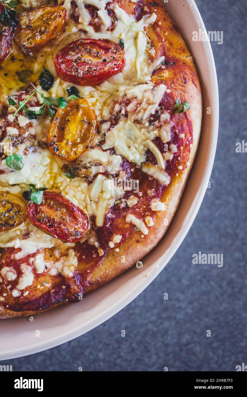 vegan margerita pizza with roasted cherry toatoes and dairy-free cheese ...