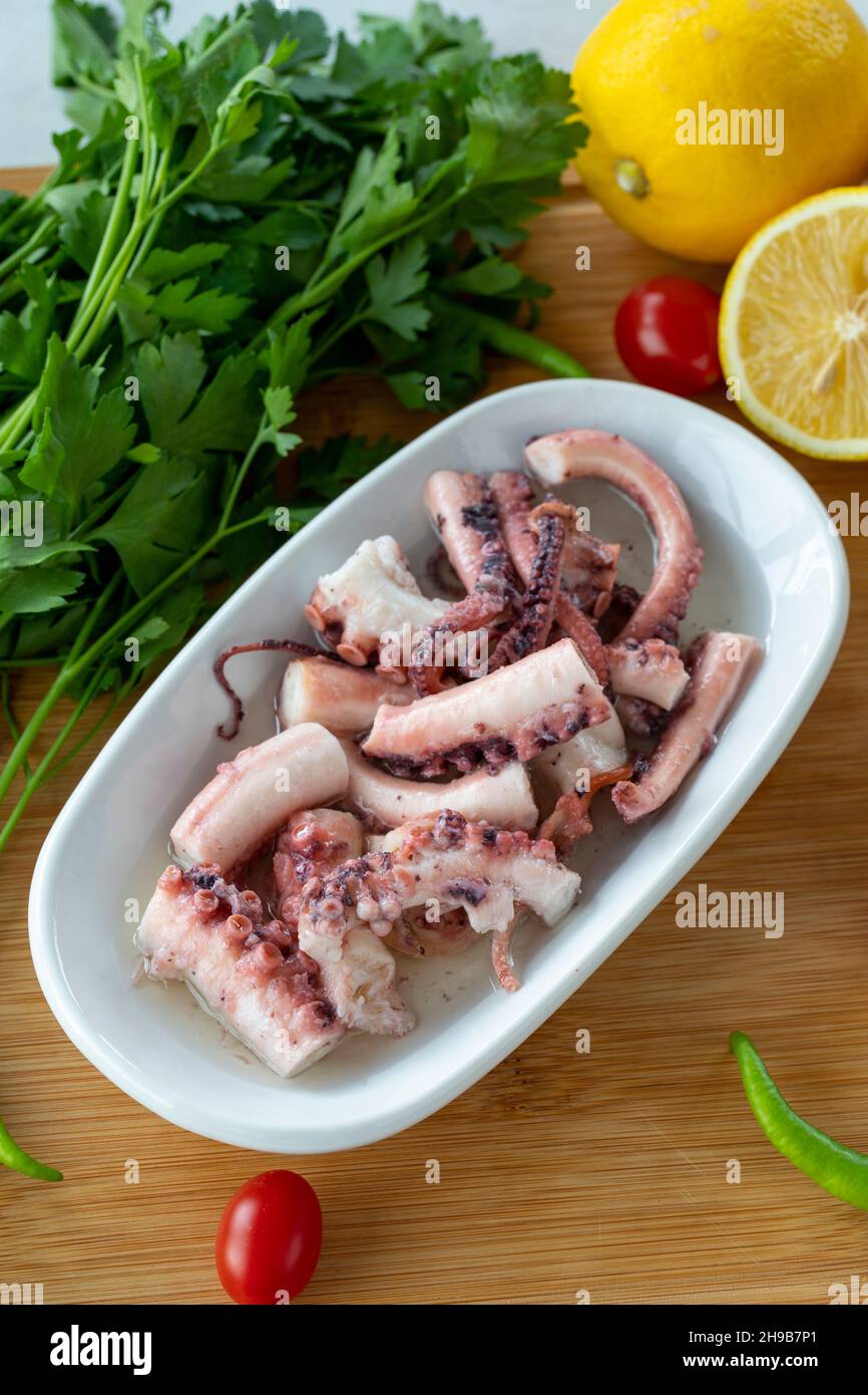 Octopus salad on wooden background. seafood dishes. Local name ahtapot ...