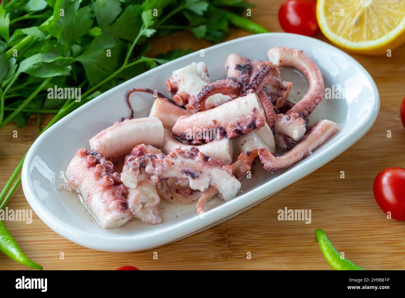 Octopus salad on wooden background. seafood dishes. Local name ahtapot ...