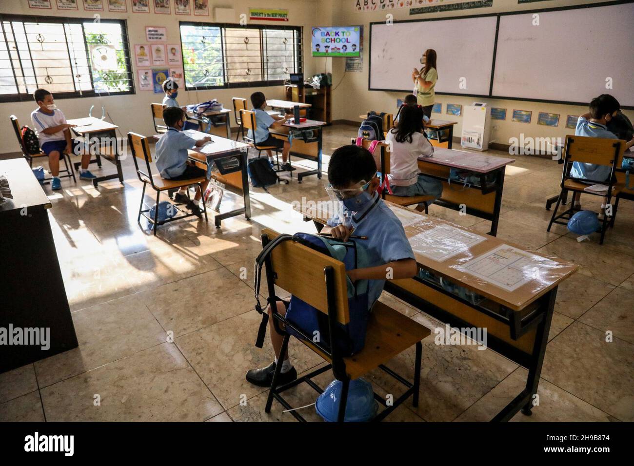 December 6, 2021: Students observe physical distancing as they attend ...