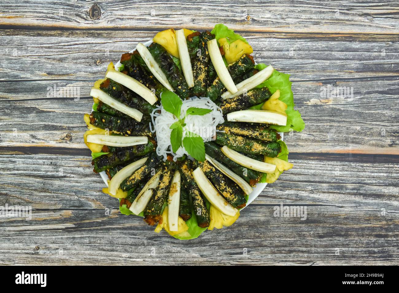 Grilled beef with guise leaves ( Bo Lui). Ingredients include ...