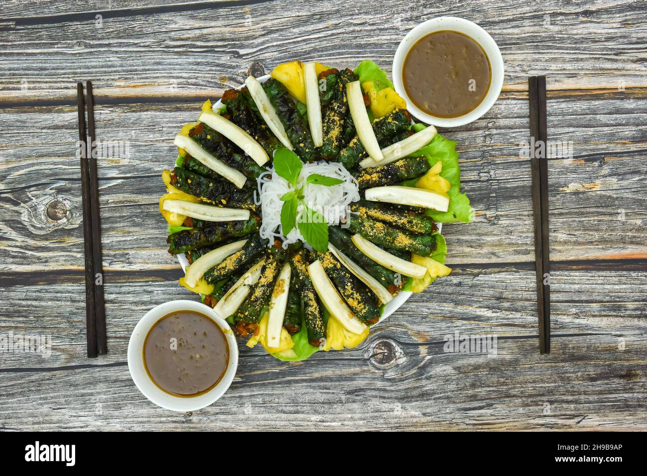 Grilled beef with guise leaves ( Bo Lui). Ingredients include ...