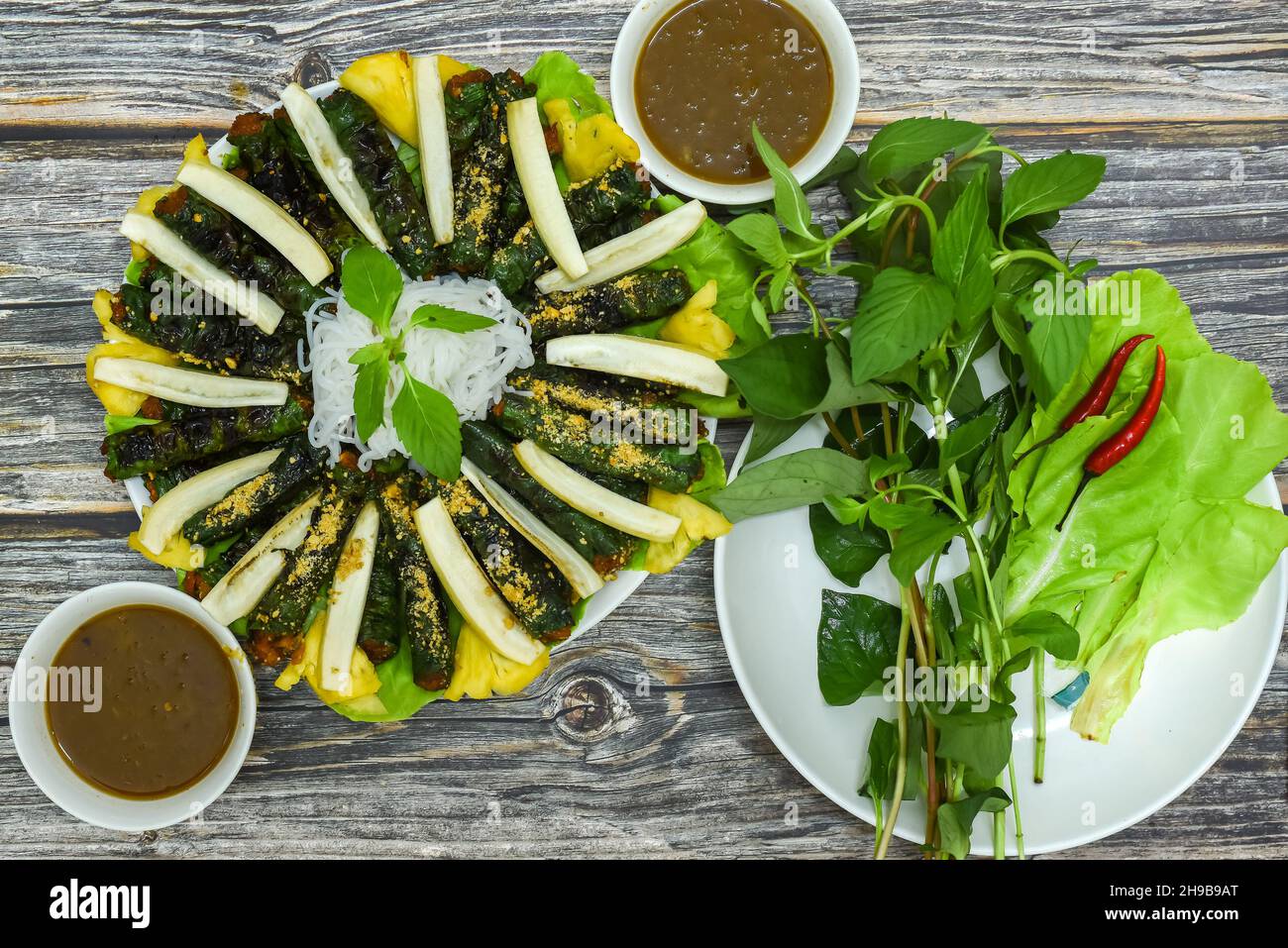 Grilled beef with guise leaves ( Bo Lui). Ingredients include ...