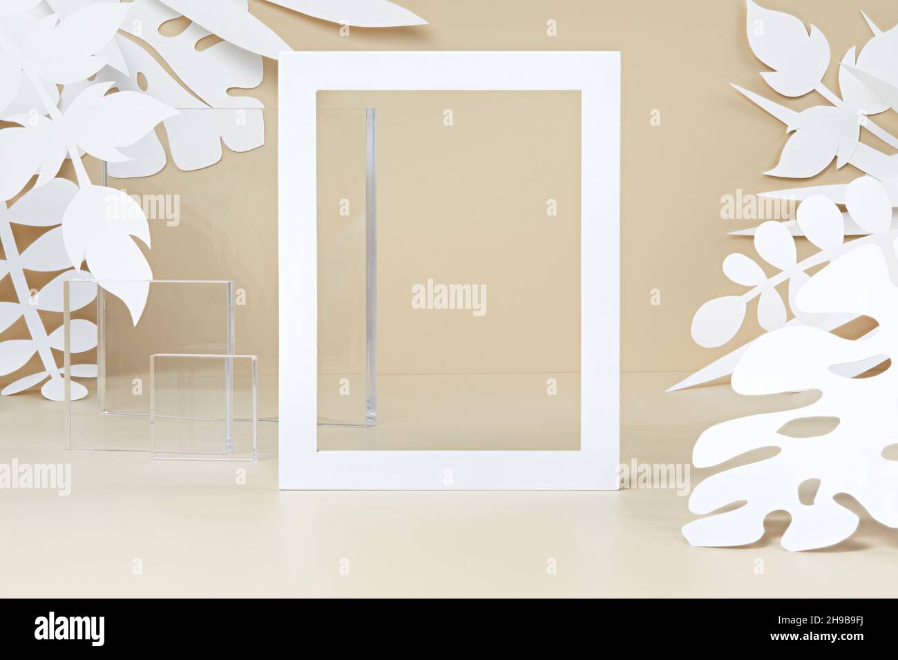3d beige scene with frame and paper cut leaves Stock Photo - Alamy
