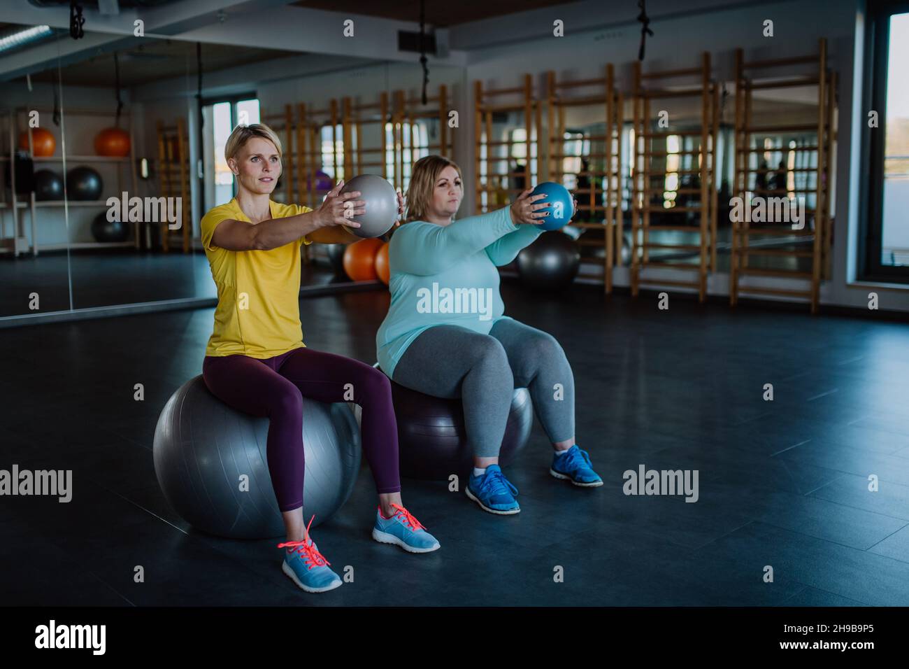 Overweight woman sitting gym ball hi-res stock photography and images ...