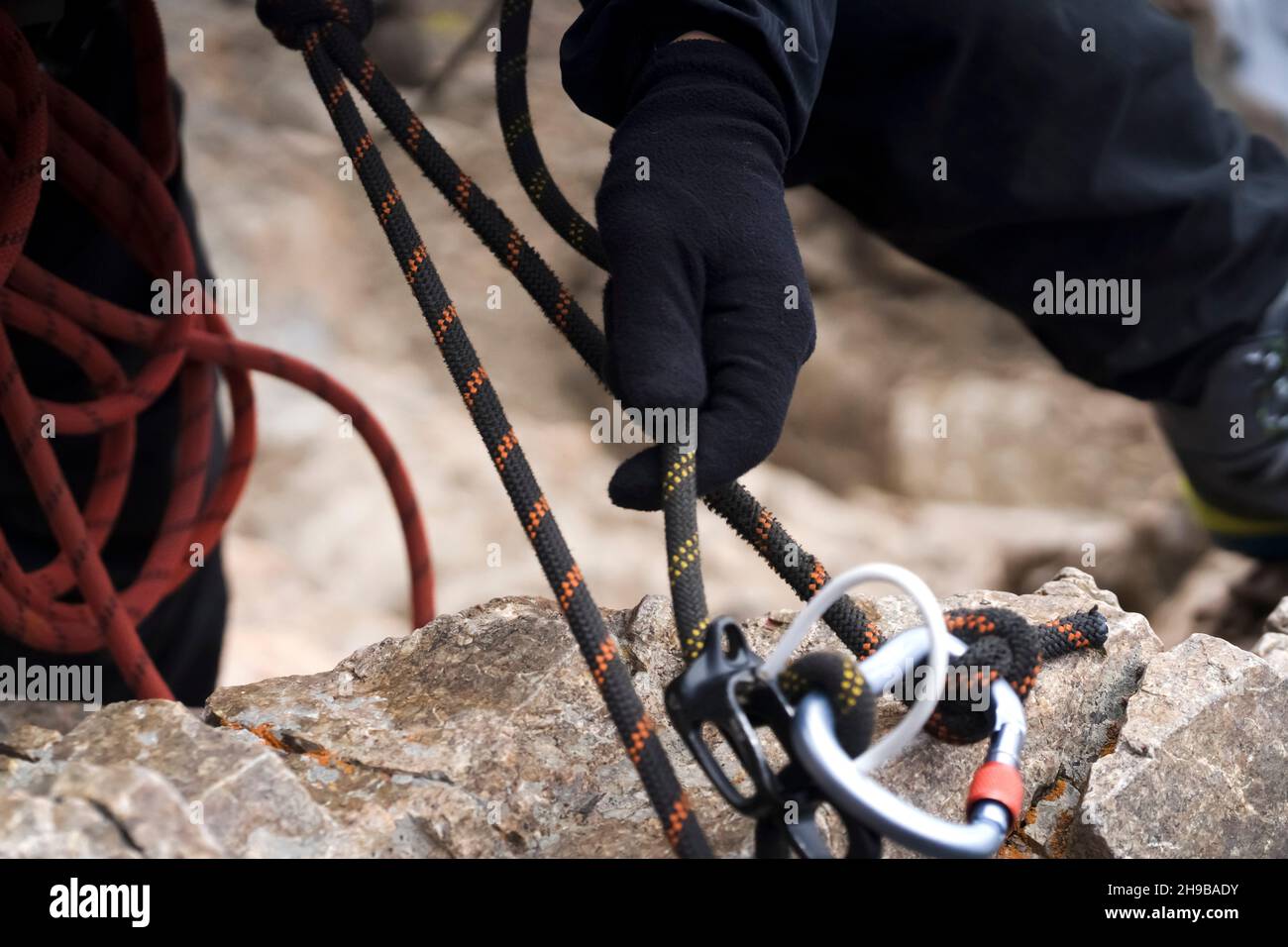 Climber is rappeling from the mountains summit Stock Photo - Alamy