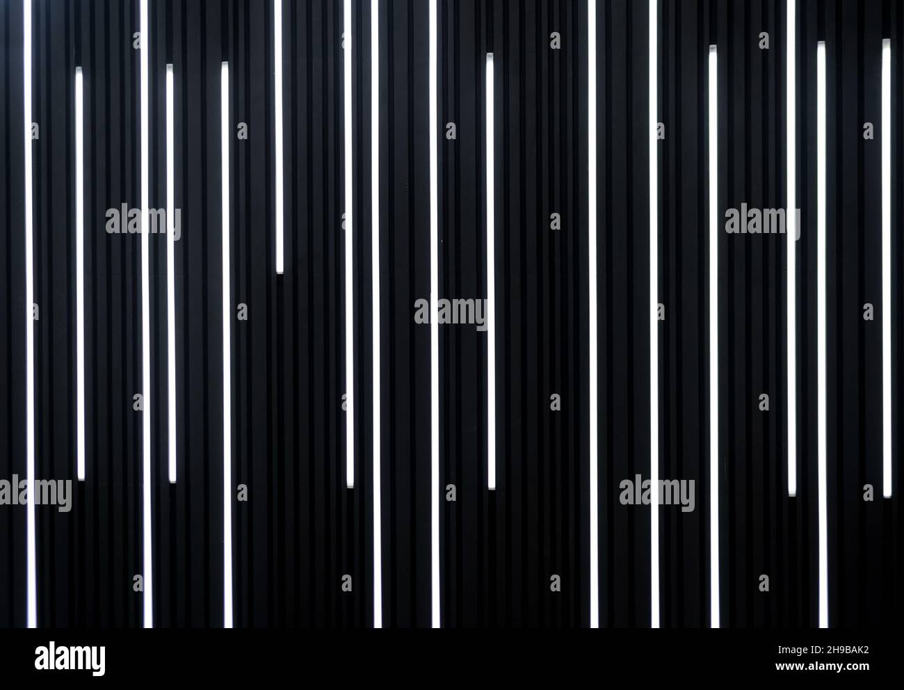 futuristic wall with striped lamps. vertical lights Stock Photo - Alamy