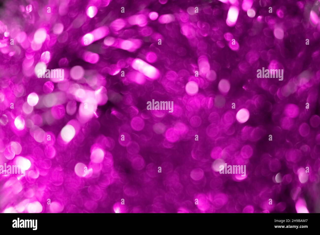 Purple mottled defocused background with lots of shiny white and lilac ...