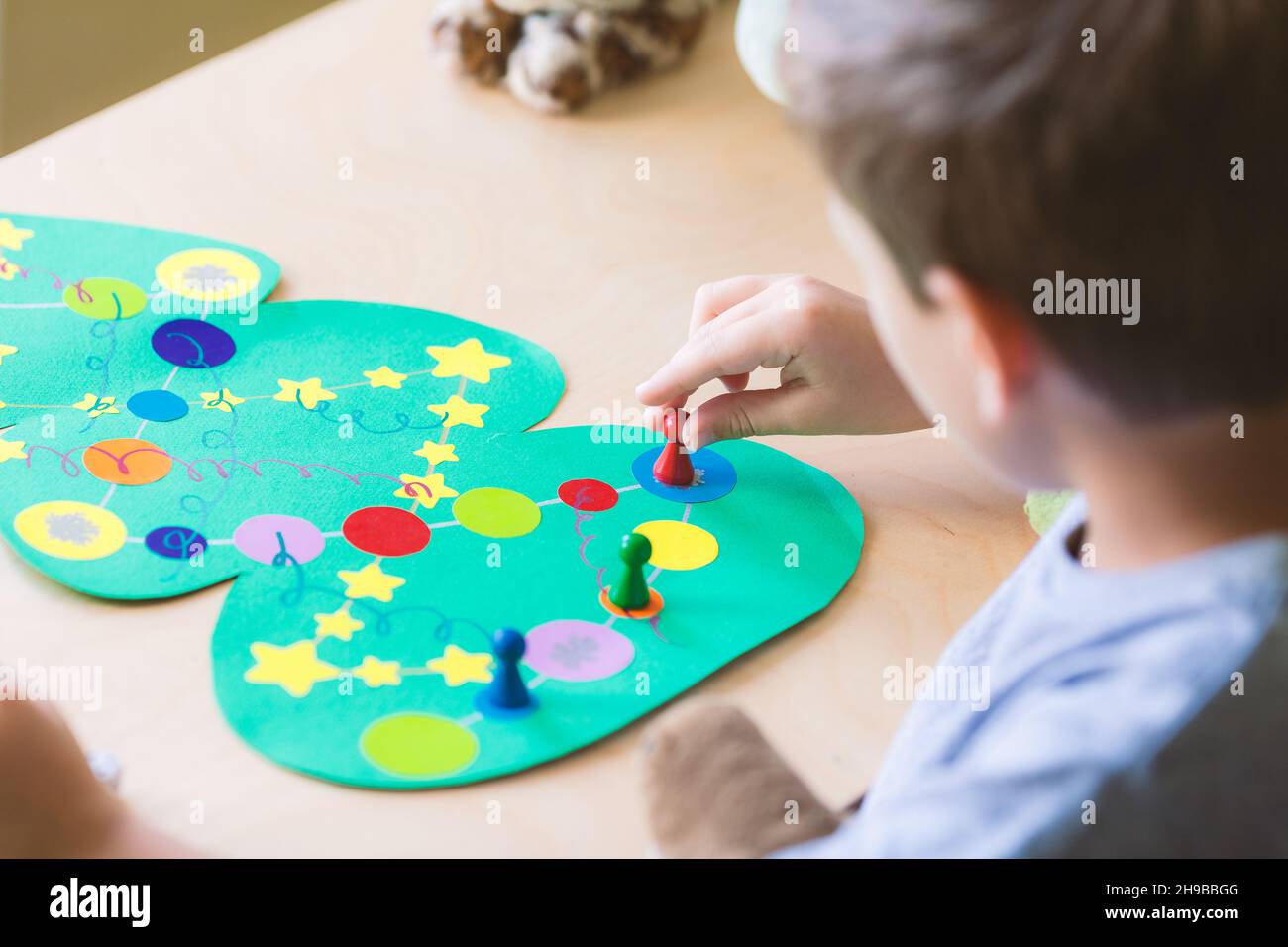 Boy playing with dice hi-res stock photography and images - Alamy
