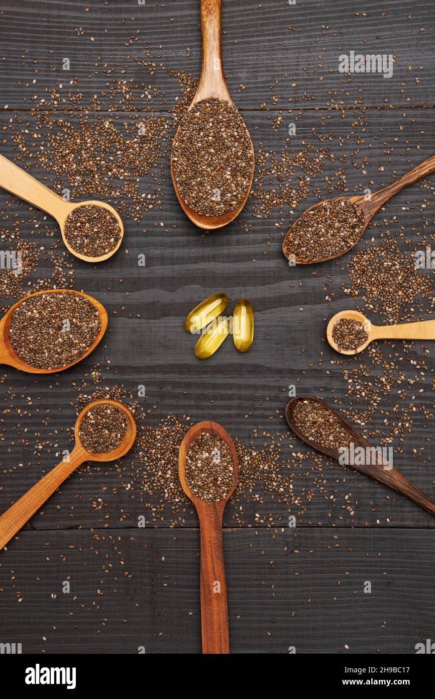 Organic natural chia seeds and wooden scoop close-up on wooden ...