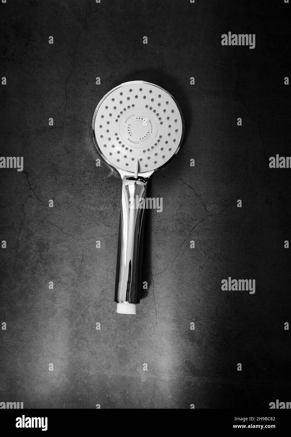 shower head with the turn lever of a spray settings on a dark ...