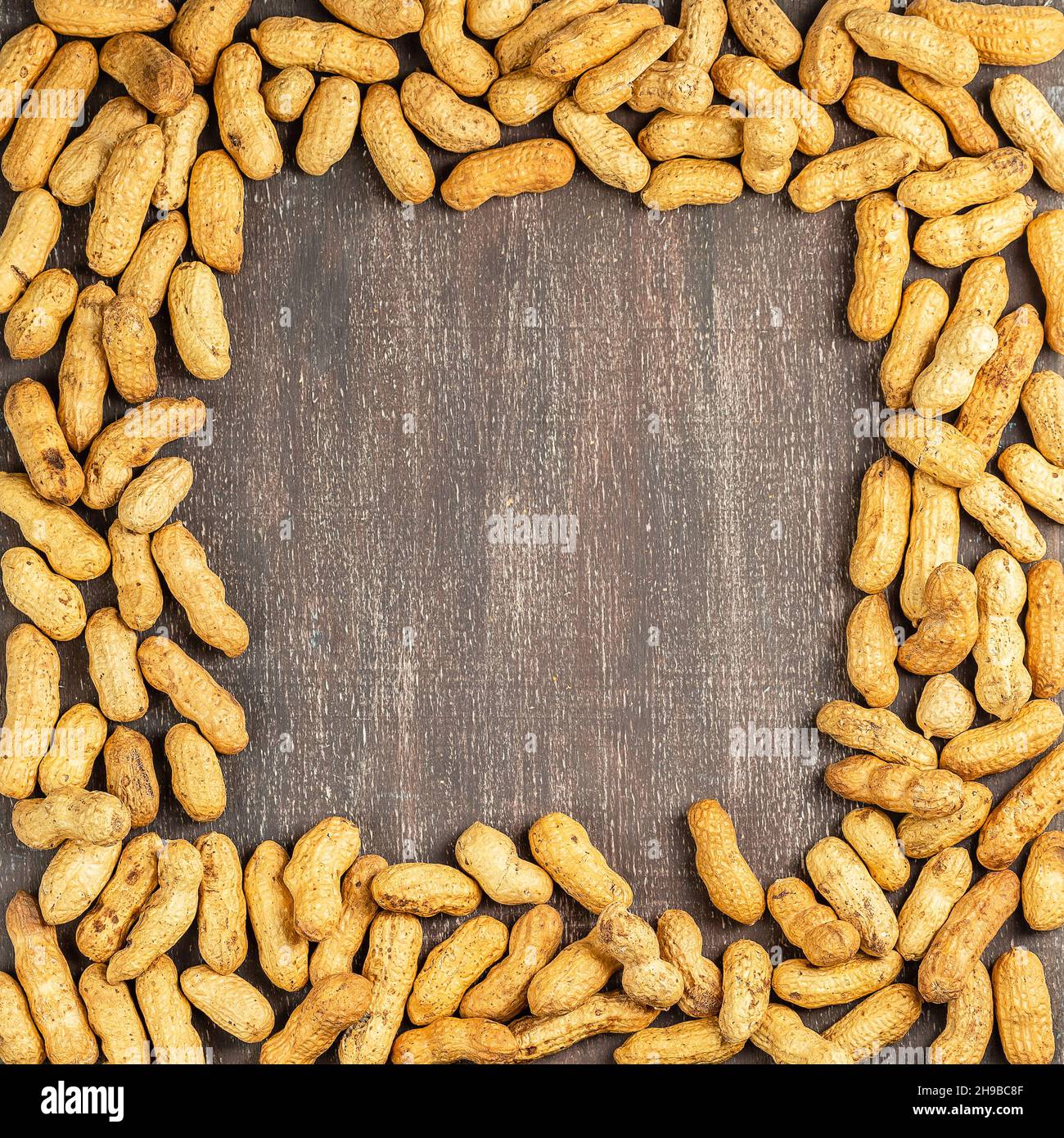 Square frame of the shelled peanuts. Not peeled groundnuts border - top ...