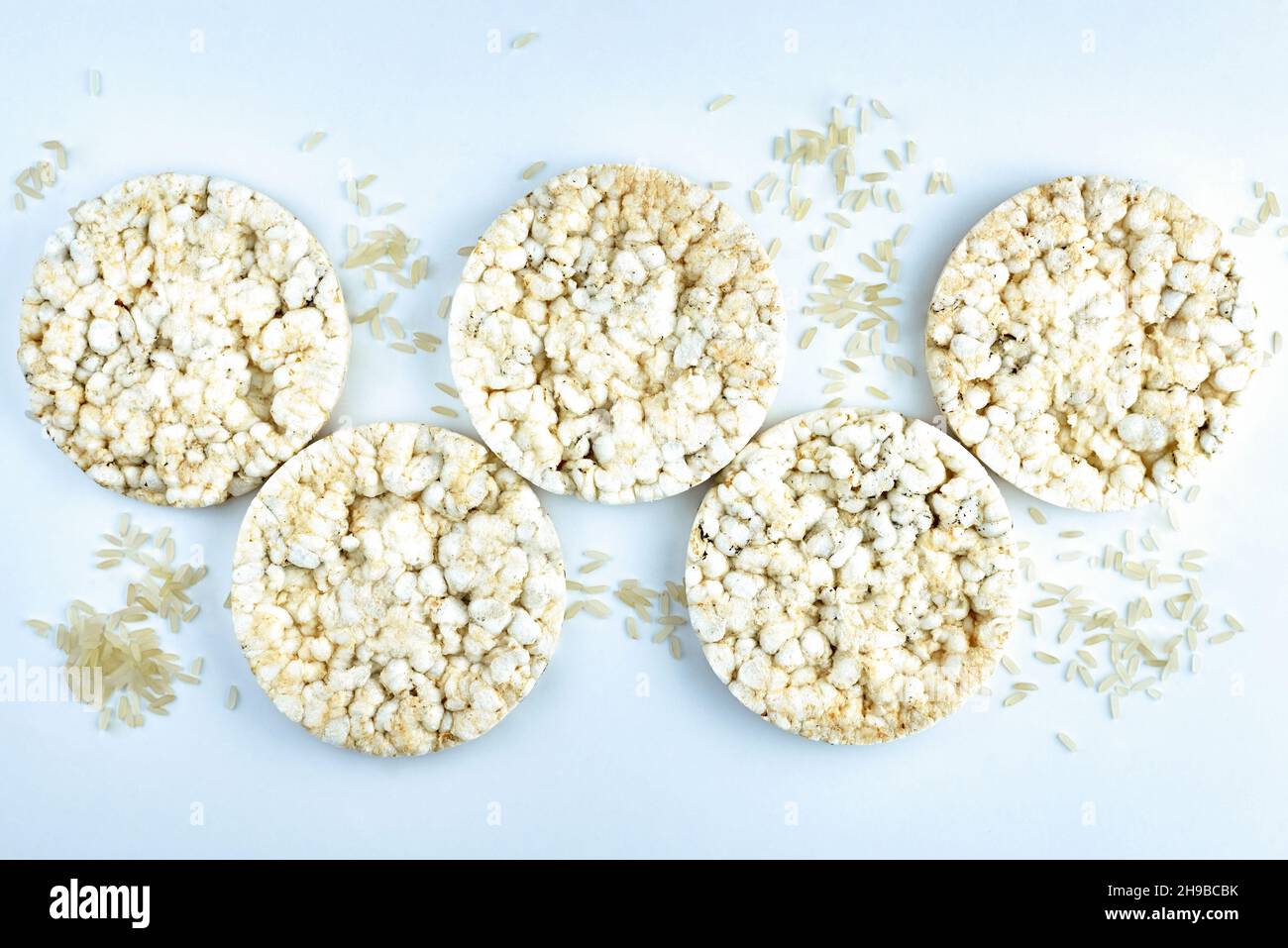 Rice round crispbread and grains of rice Stock Photo - Alamy