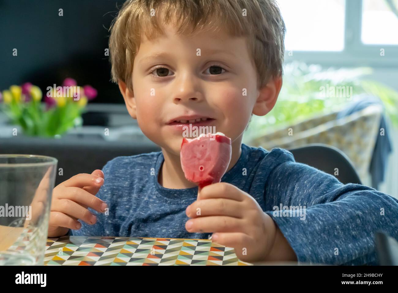 Child eating icecream, a close up Stock Photo - Alamy