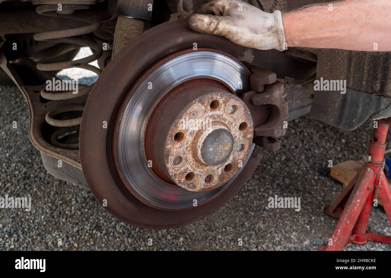 Auto mechanic working on brakes hi-res stock photography and images - Alamy
