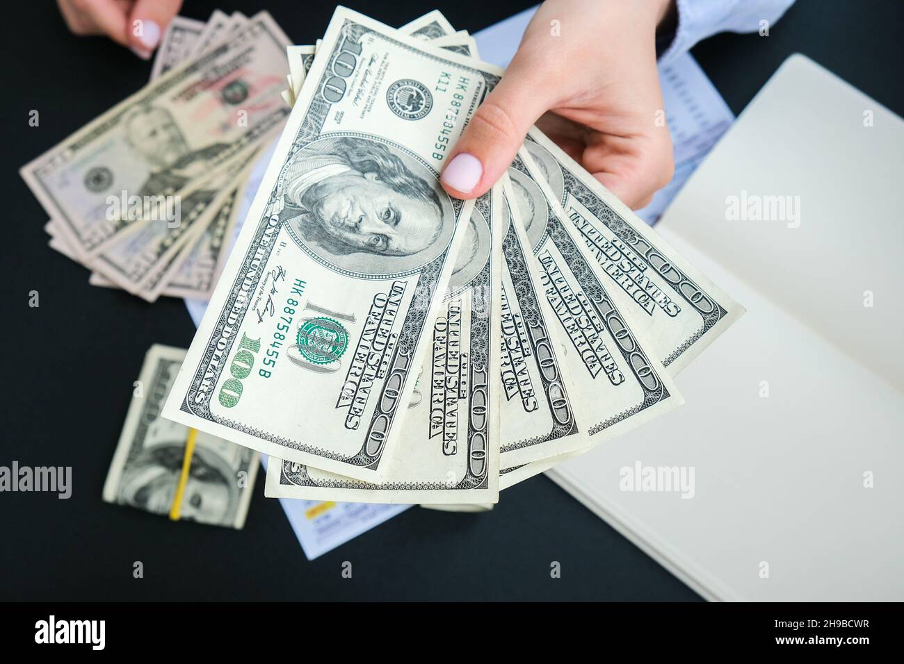 Business woman displaying spread cash hi-res stock photography and ...