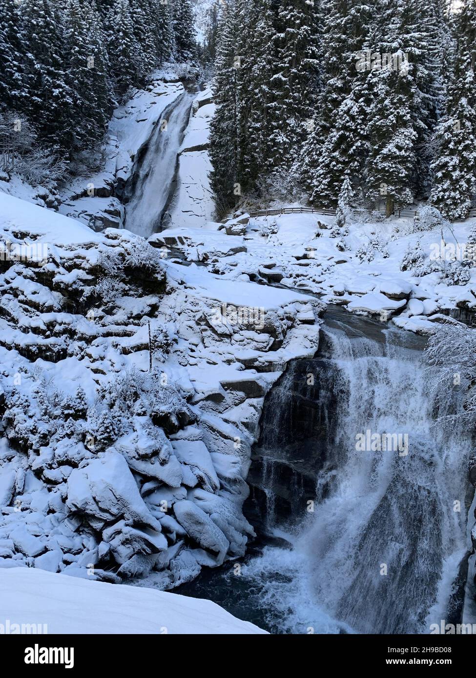 Chilling view of a waterfall in a winter forest Stock Photo - Alamy