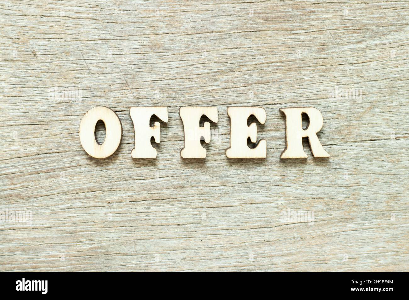 Alphabet letter in word offer on wood background Stock Photo - Alamy