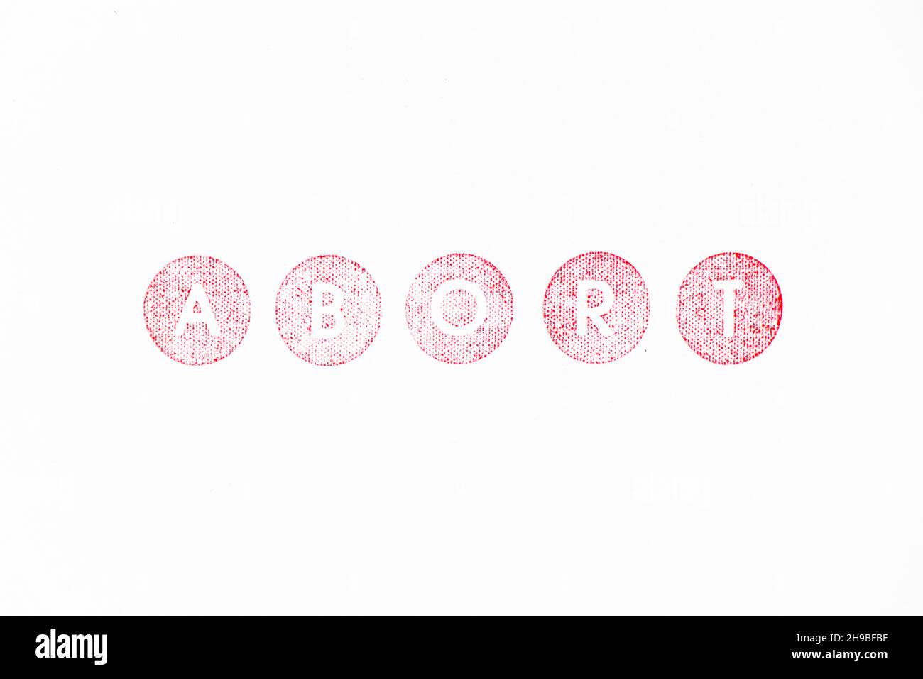 Red color rubber stamp in word abort on white paper background Stock ...