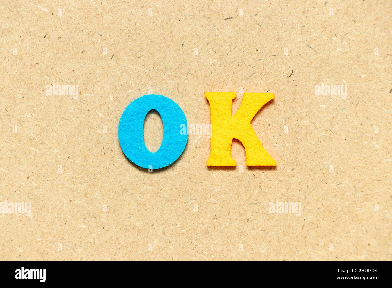 Color cloth alphabet letter in word OK on wood background Stock Photo ...