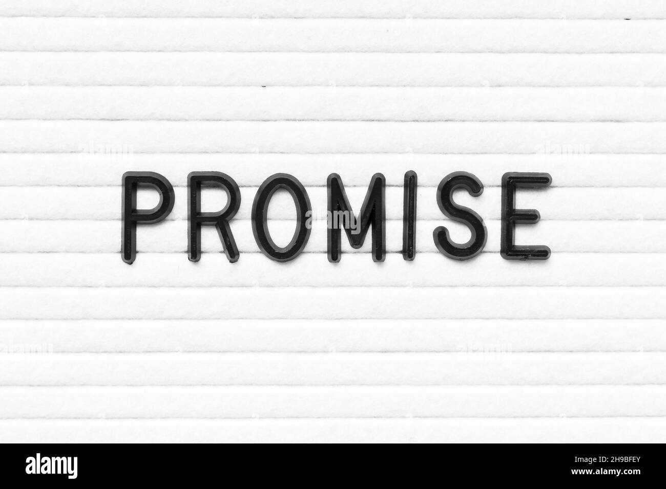Black letter in word promise on white felt board background Stock Photo ...