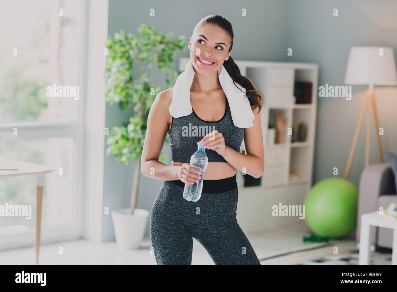 Photo of pretty dreamy girl dressed sport suit back chair drinking ...