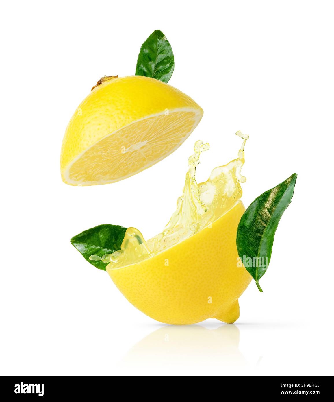Cut lemon and splashing juice isolated on white background with ...