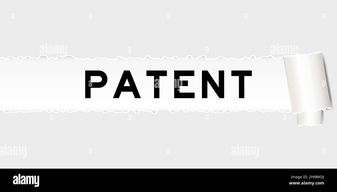 Ripped gray paper background that have word patent under torn part ...
